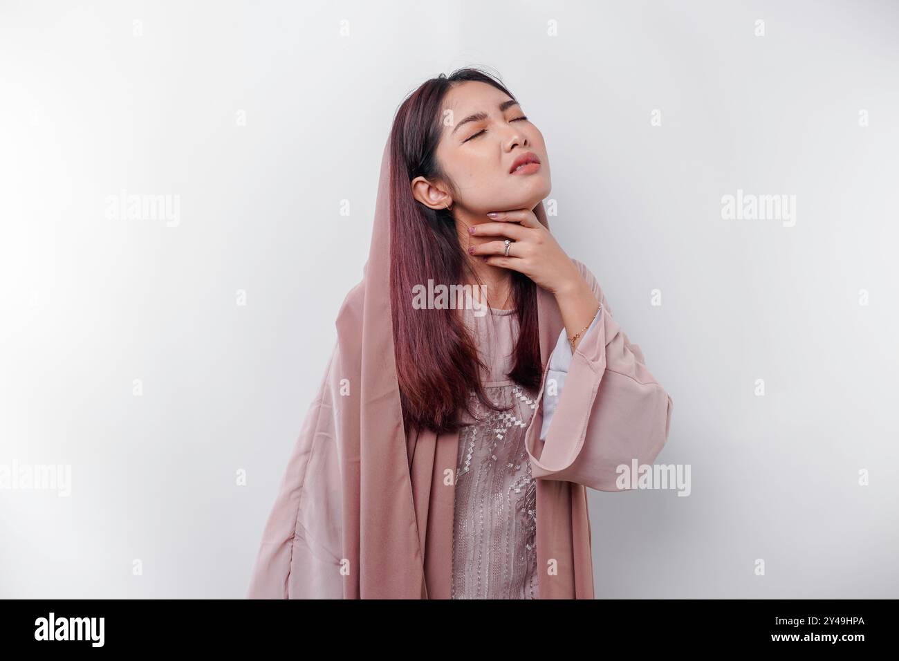 An Asian Muslim Woman Feels So Thirsty Because Of The Hot Weather During The Summer Season While