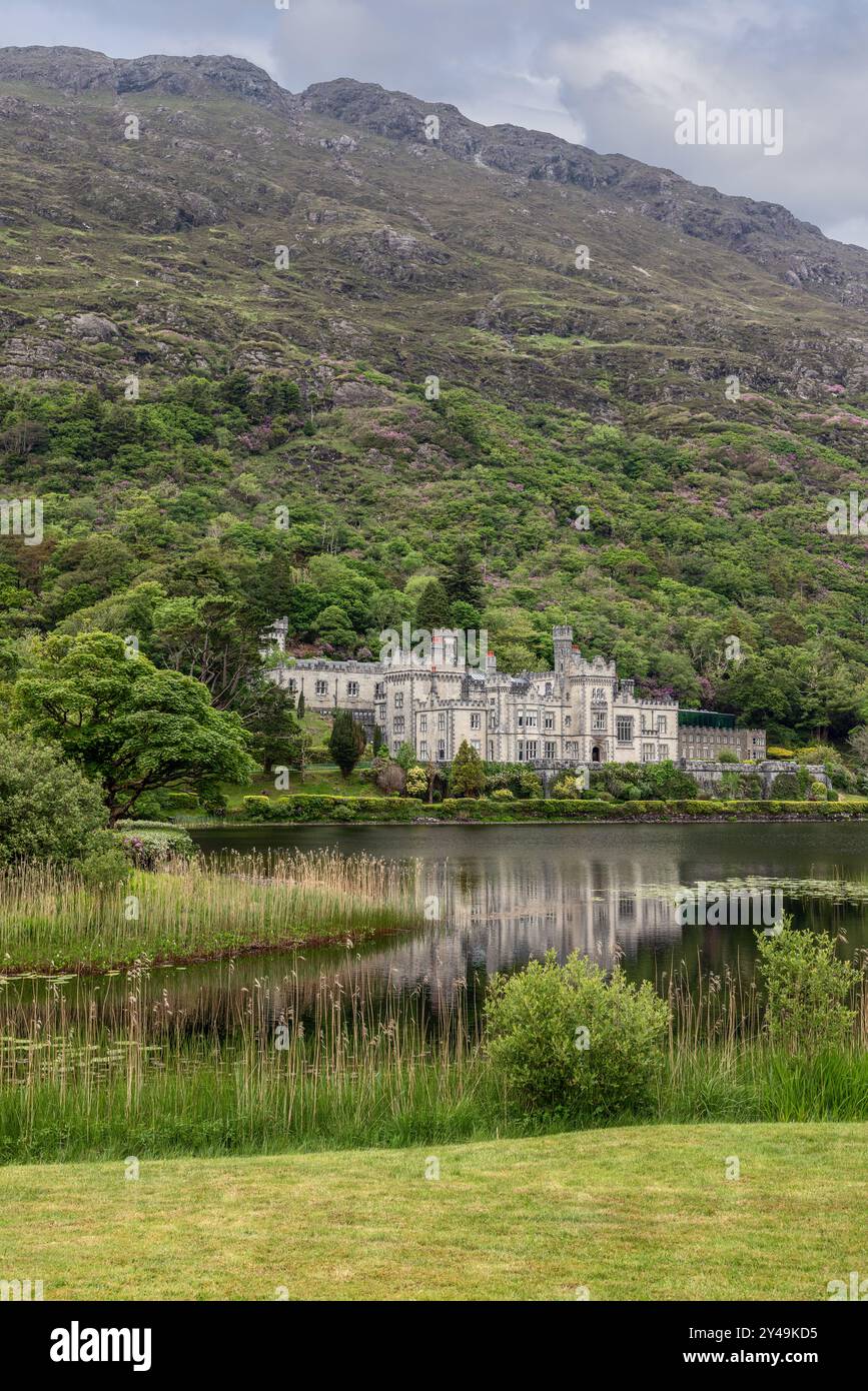 Vertical photo of Kylemore Abbey by Pollacapall Lough in Connemara ...