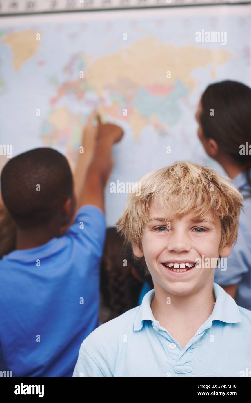Map, education and portrait of child in classroom for direction, search ...