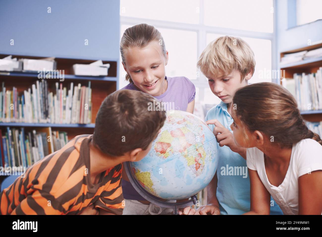 World map, students and kids in classroom, globe and conversation with ...