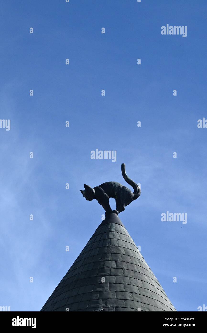 Cat House in Riga, Latvia. The cat sculpture on the roof of Cat House ...