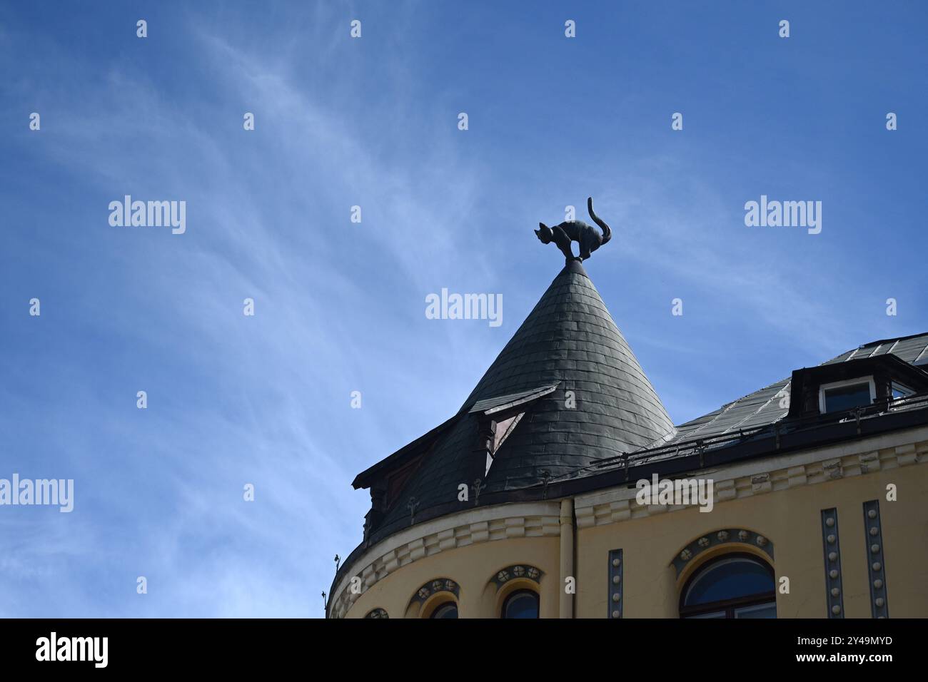 Cat House in Riga, Latvia. The cat sculpture on the roof of Cat House ...