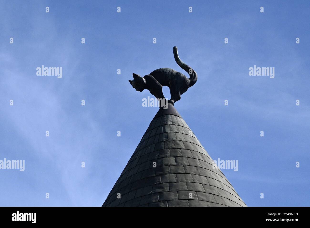 Cat House in Riga, Latvia. The cat sculpture on the roof of Cat House ...