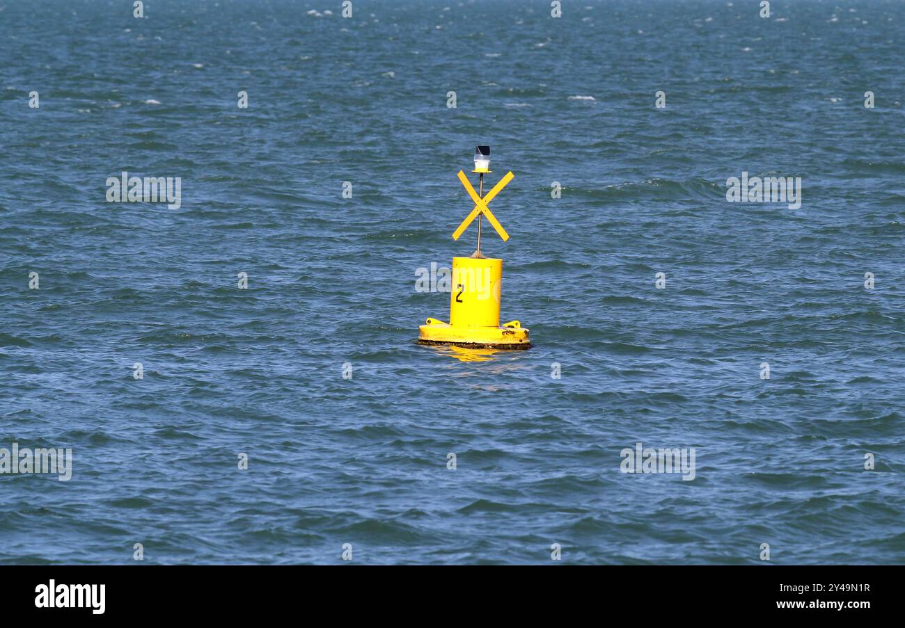 Yellow buoy navigation marker in the ocean sea Stock Photo - Alamy