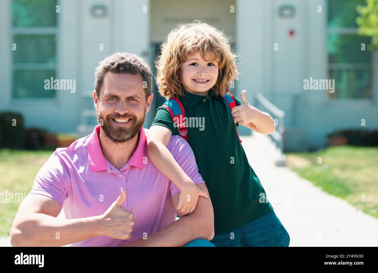 Teachers day. Father supports and motivates son. Kid going to primary ...