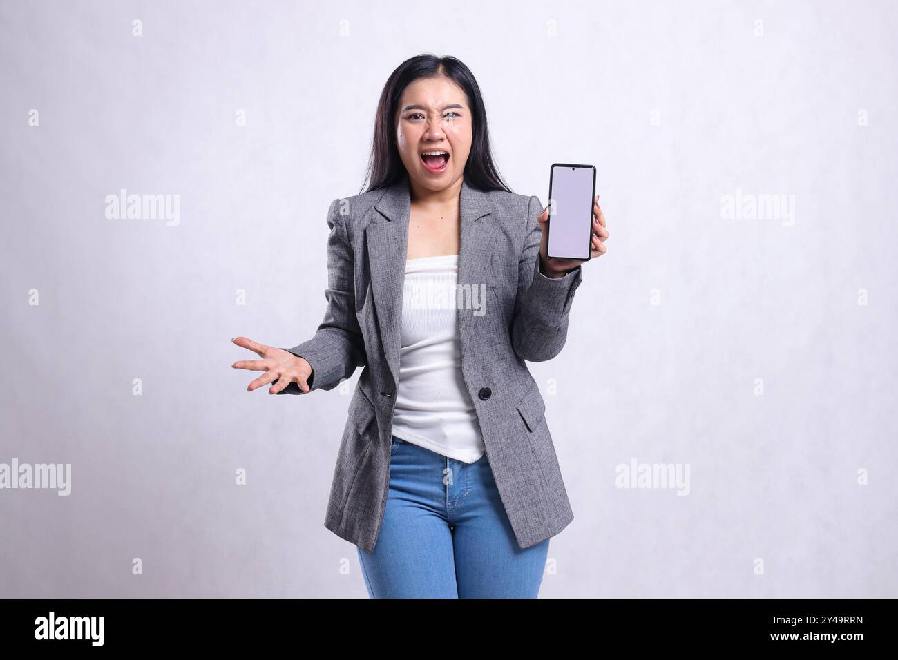 expression of beautiful young office female shouting to camera palm ...