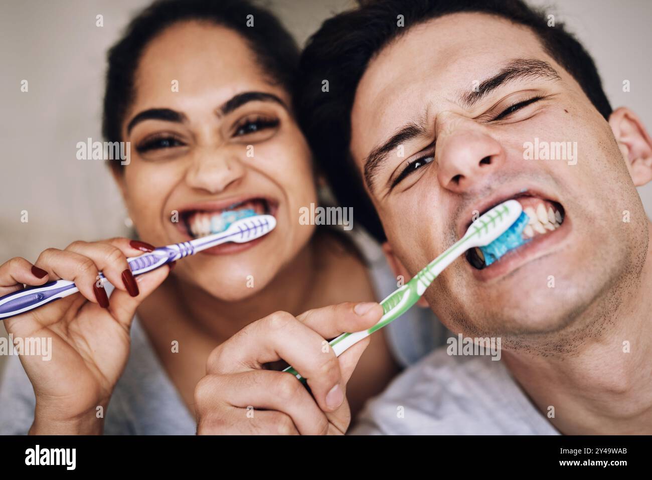 Couple, brushing teeth and happy in portrait, home and together for ...