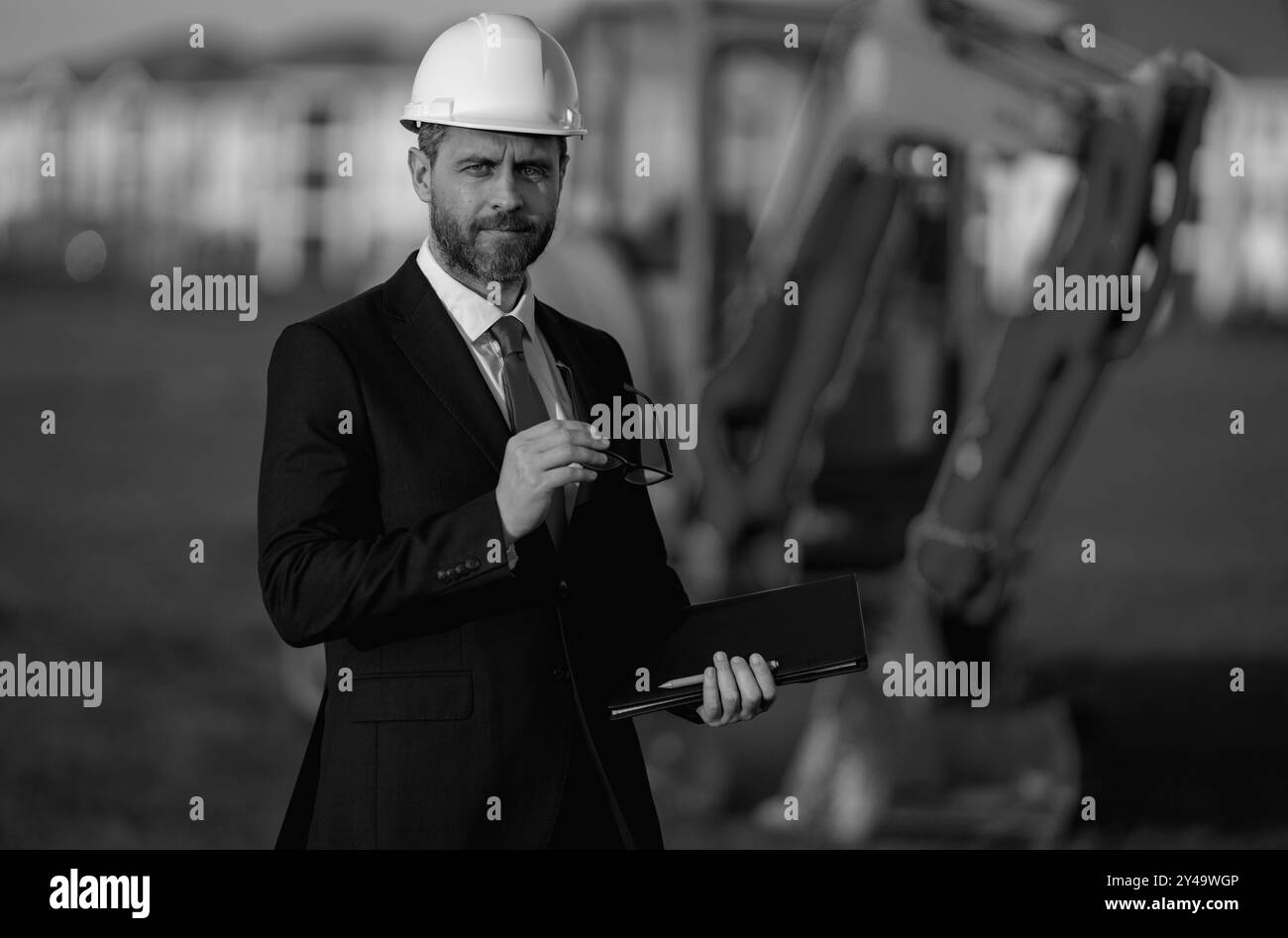 Civil engineer worker at a construction site. Mature engineer worker ...