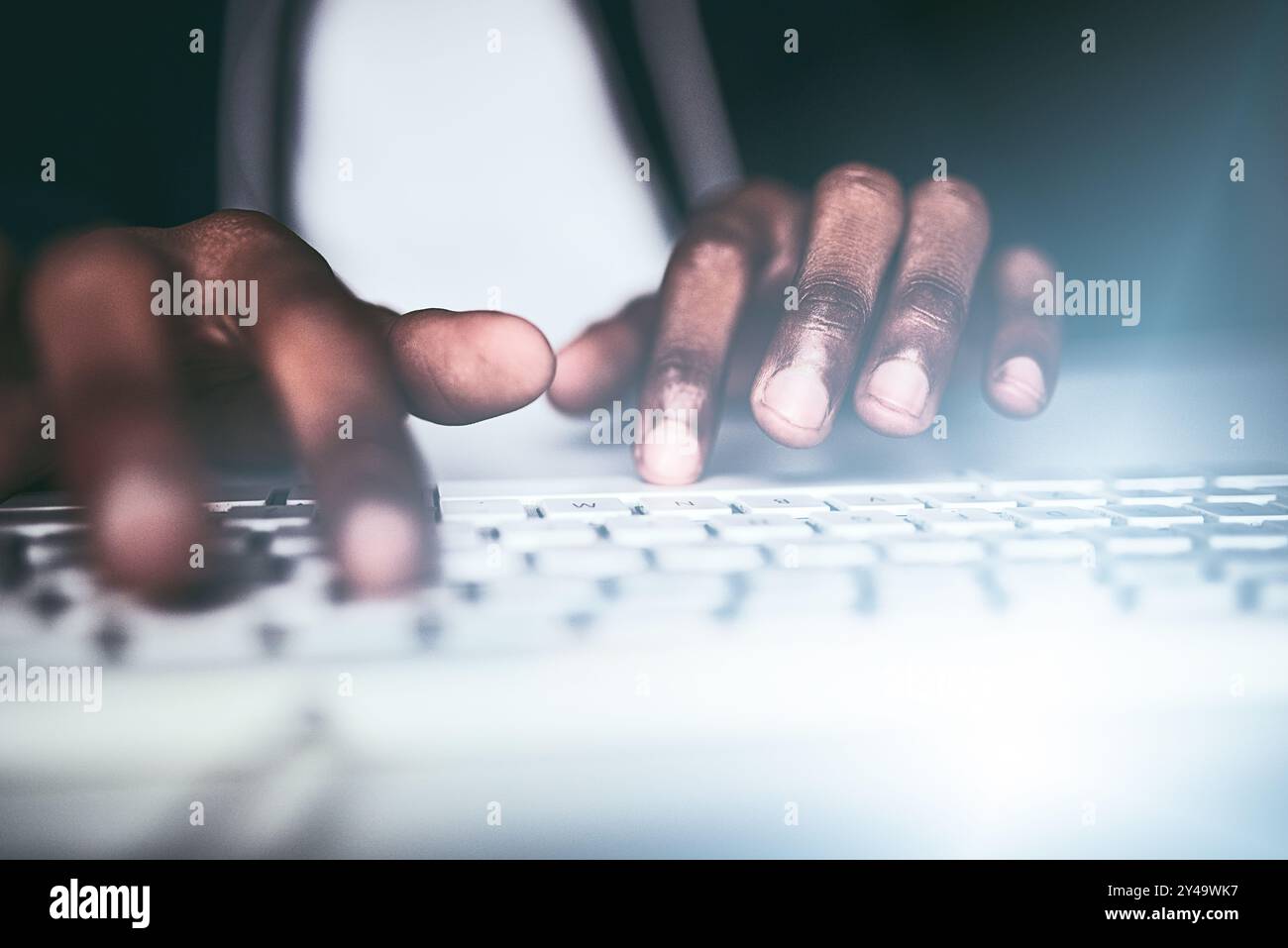 Hacker, coding and hands in night with keyboard, typing and information technology, criminal and ...