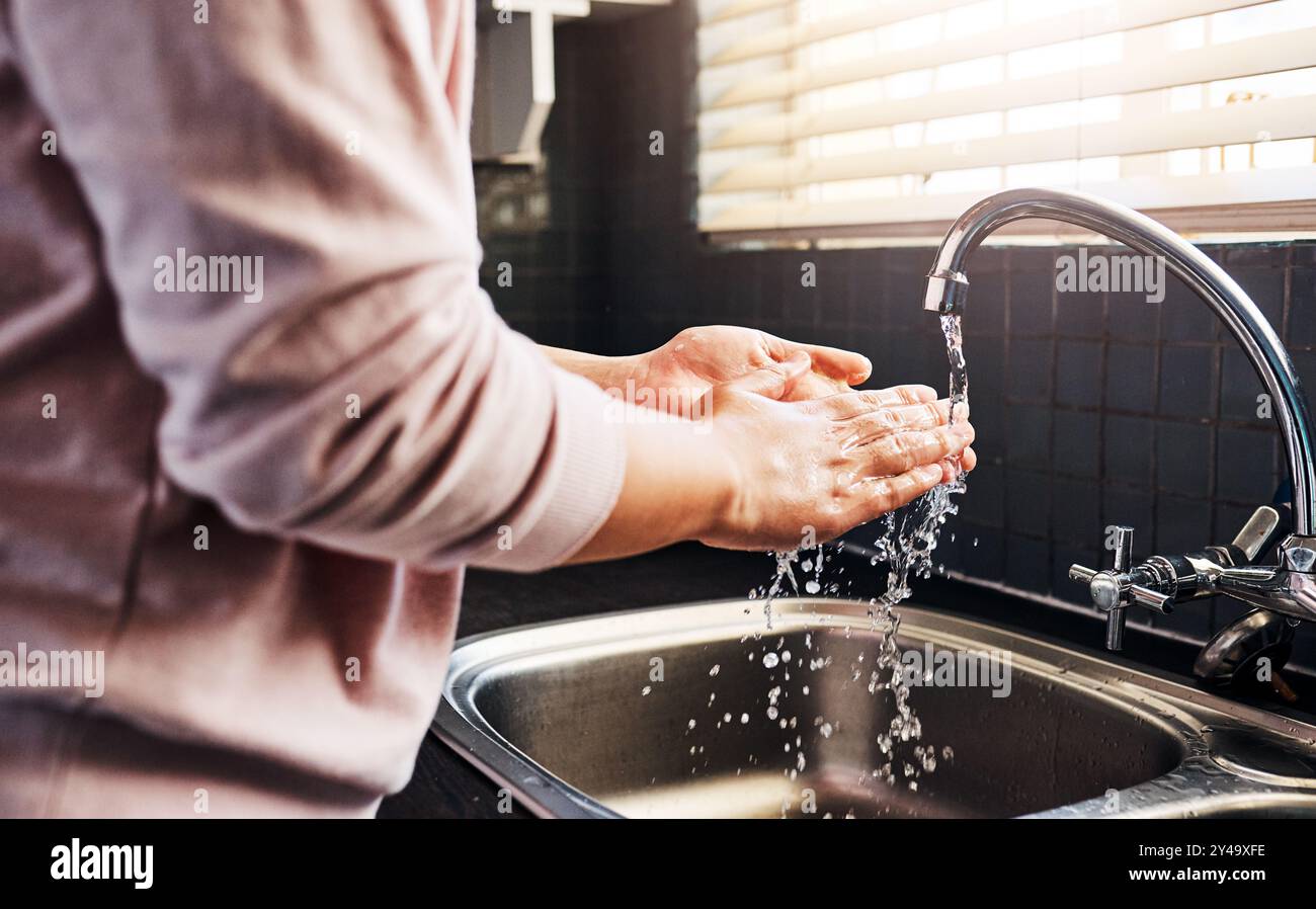 Washing hands, faucet and water by kitchen sink, person and hygiene for ...