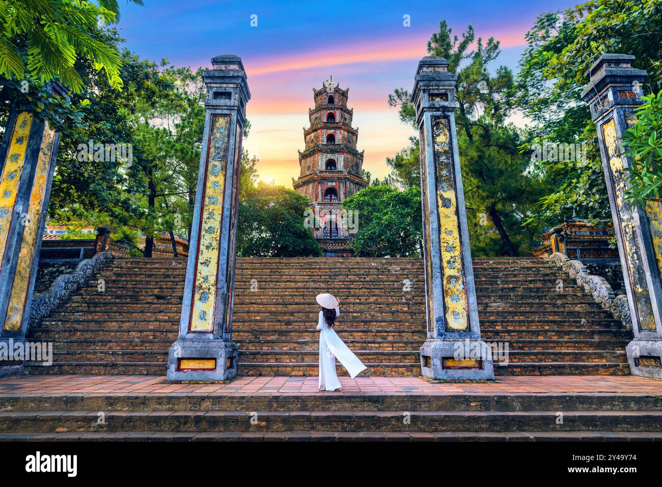 Tourists visit around the Thien Mu Pagoda, Hue in Vietnam. Translation ...