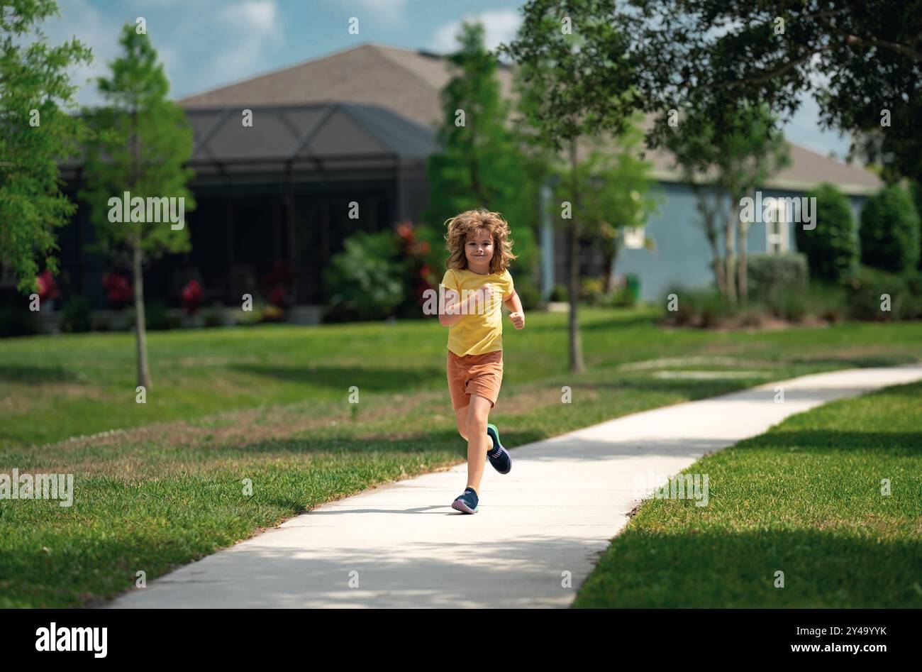 Child running in summer street. Kid enjoy run. Kid running on ...