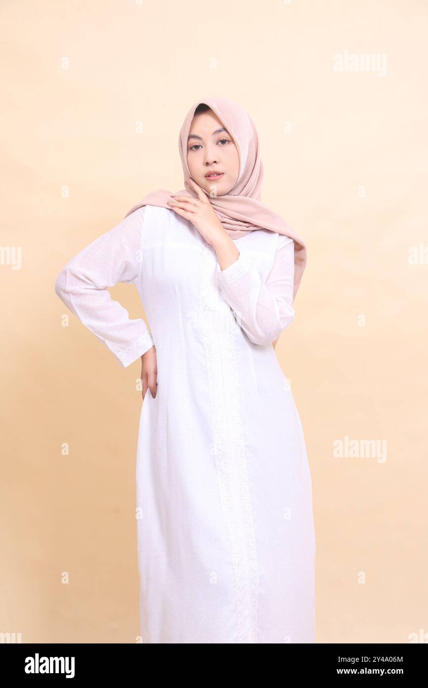 woman indonesia wearing beautiful elegant Muslim dress poses hand ...