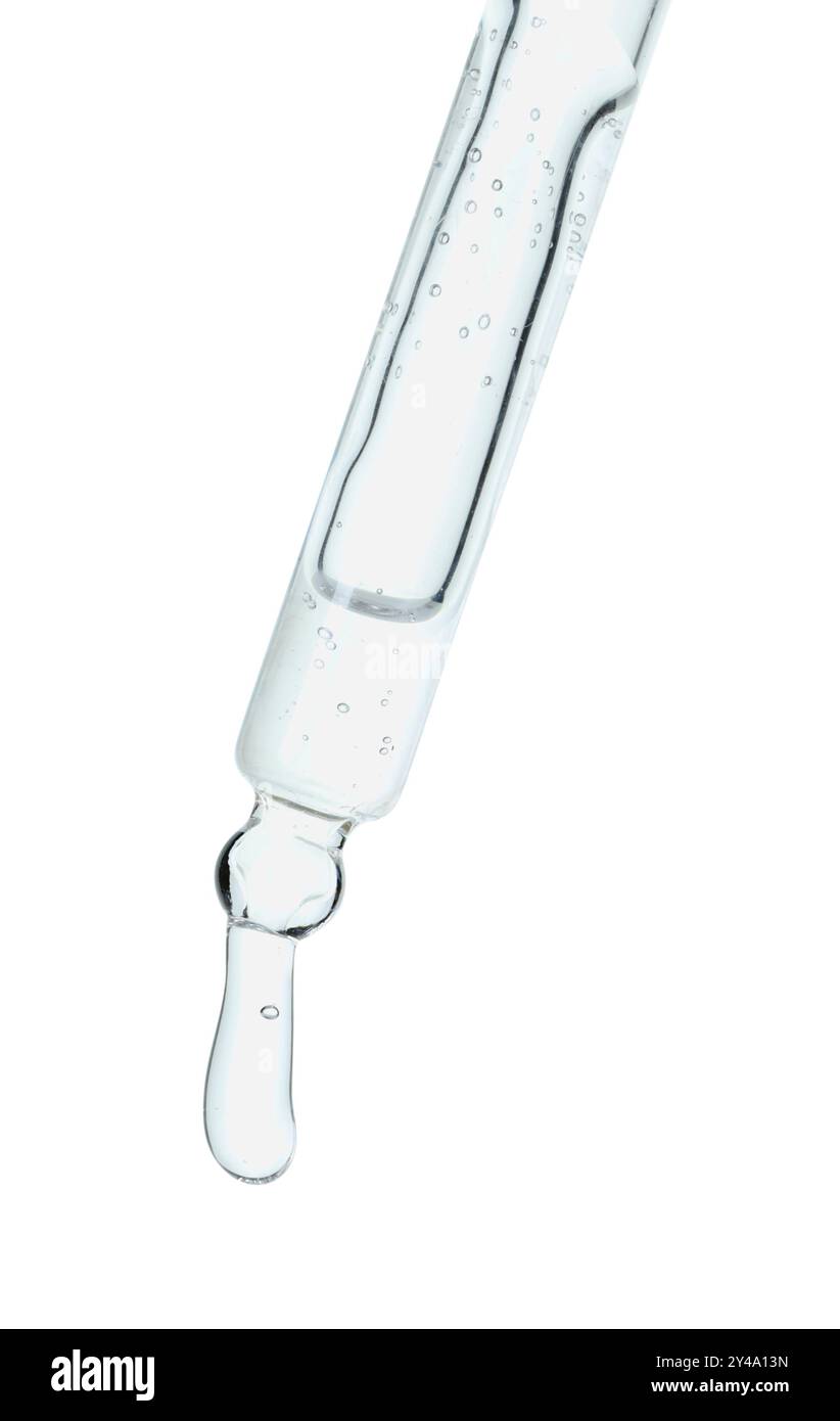 Dripping cosmetic serum from pipette on white background Stock Photo ...