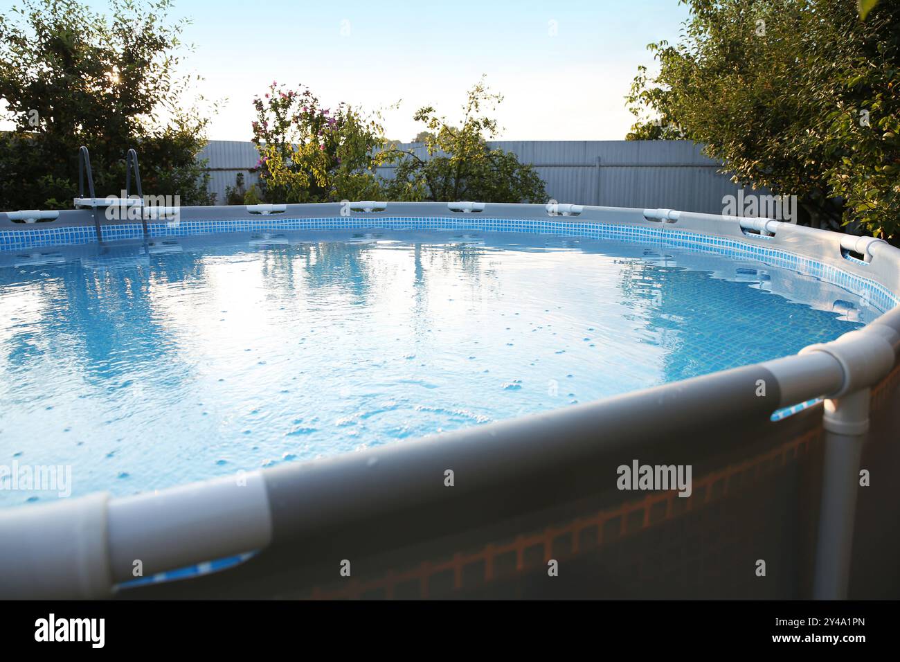 Above ground swimming pool ladder hi-res stock photography and images ...