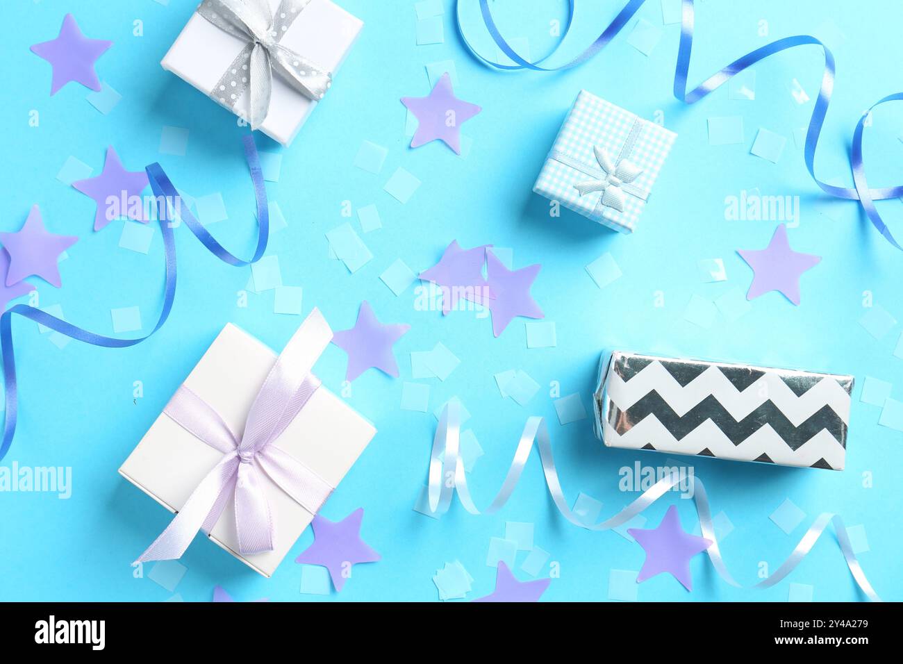 Confetti, party streamers and gift boxes on light blue background, flat ...