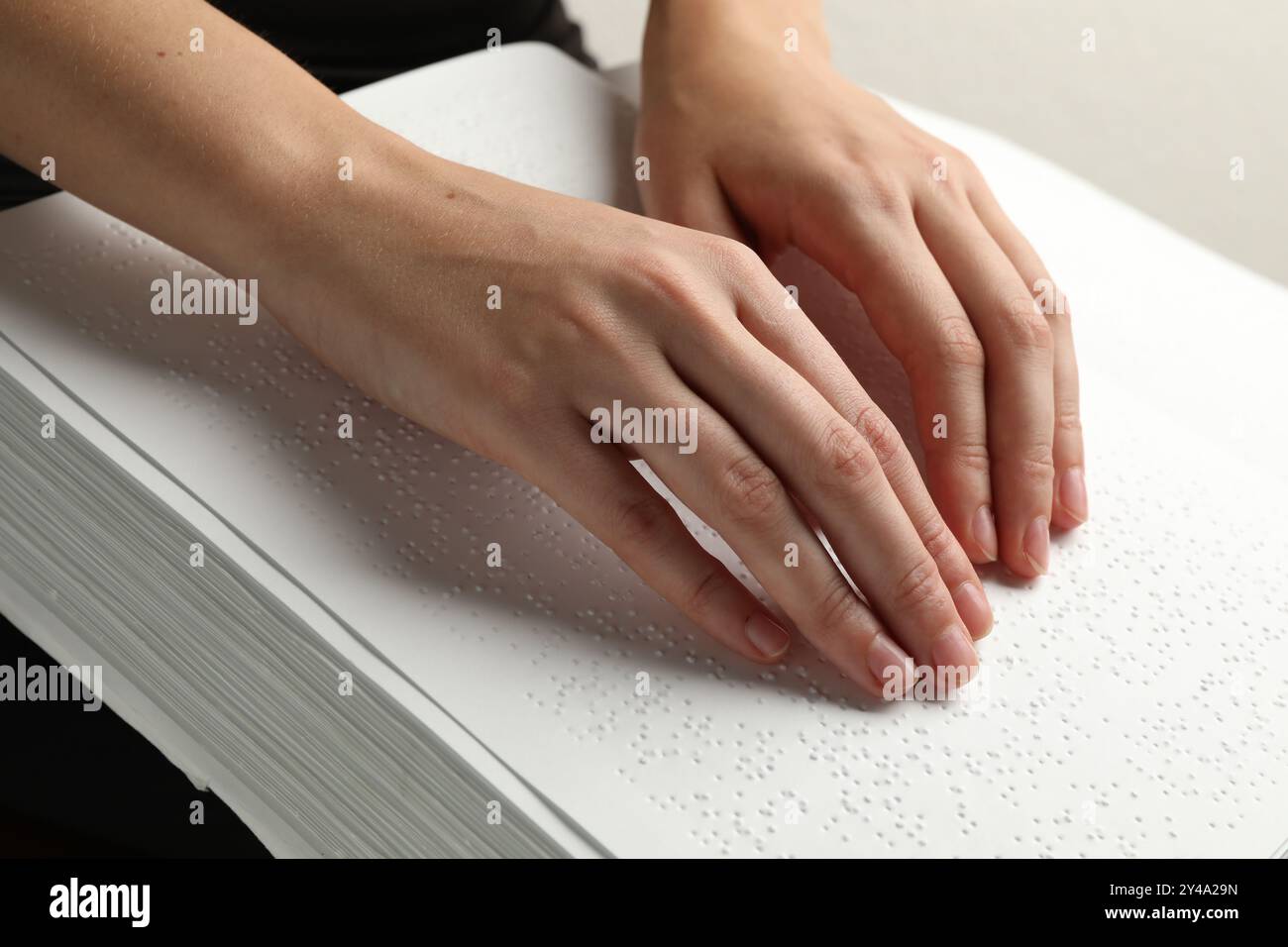 Blind woman reading book written in Braille indoors, closeup Stock ...