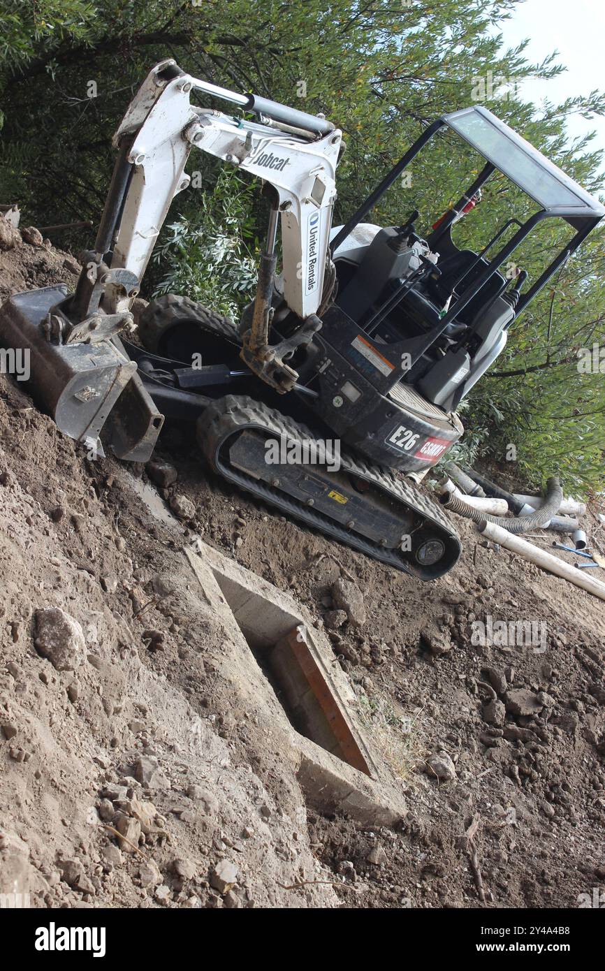 bob cat excavator at a construction site,heavy machinery for earthworks ...