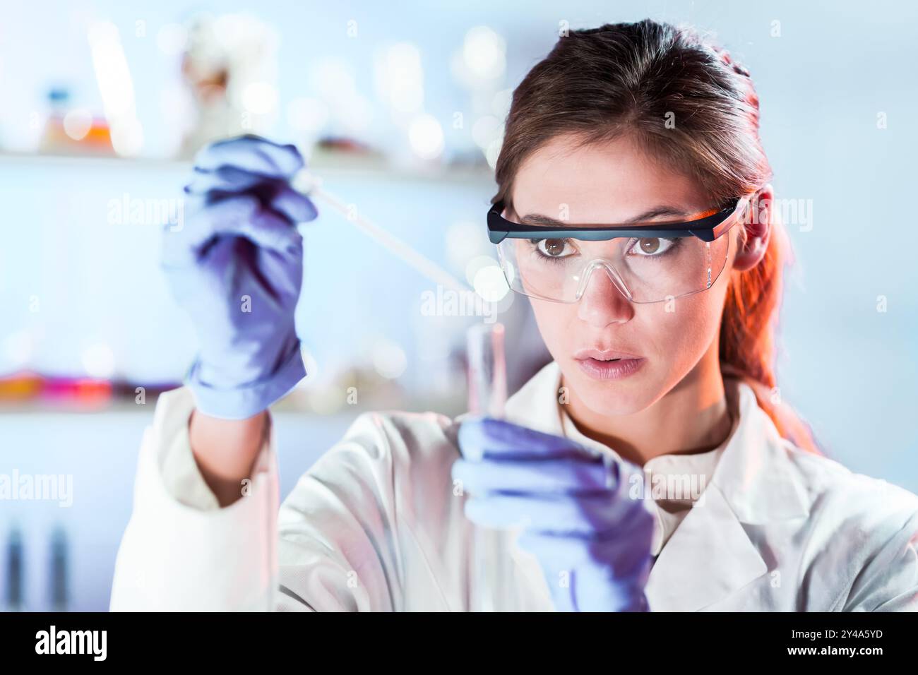Scientist pipetting cuvette hi-res stock photography and images - Alamy