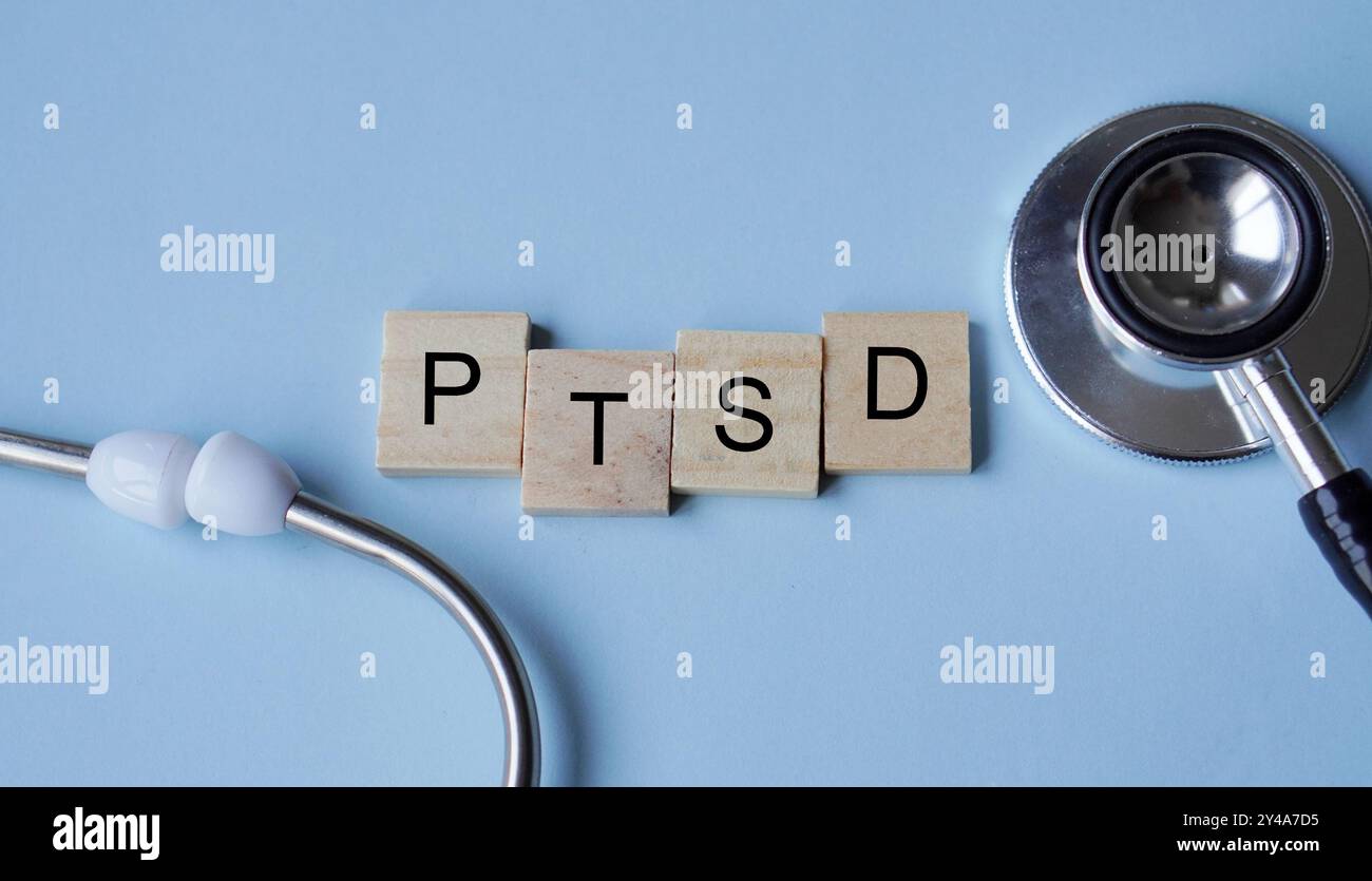 PTSD. Post traumatic stress disorder. wooden letters with stethoscope ...
