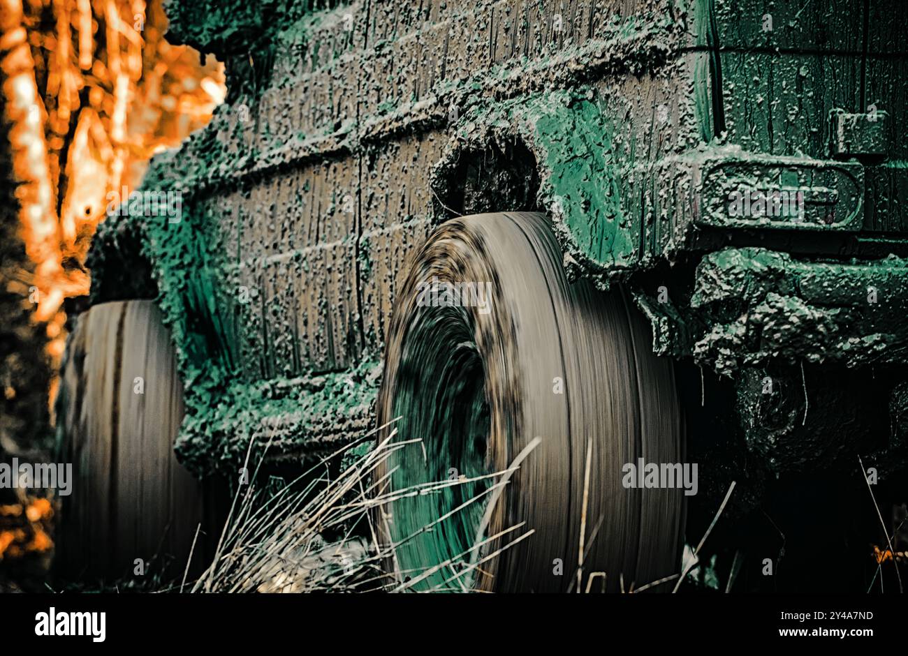 Bottom view to big offroad car wheel on country road and mountains ...