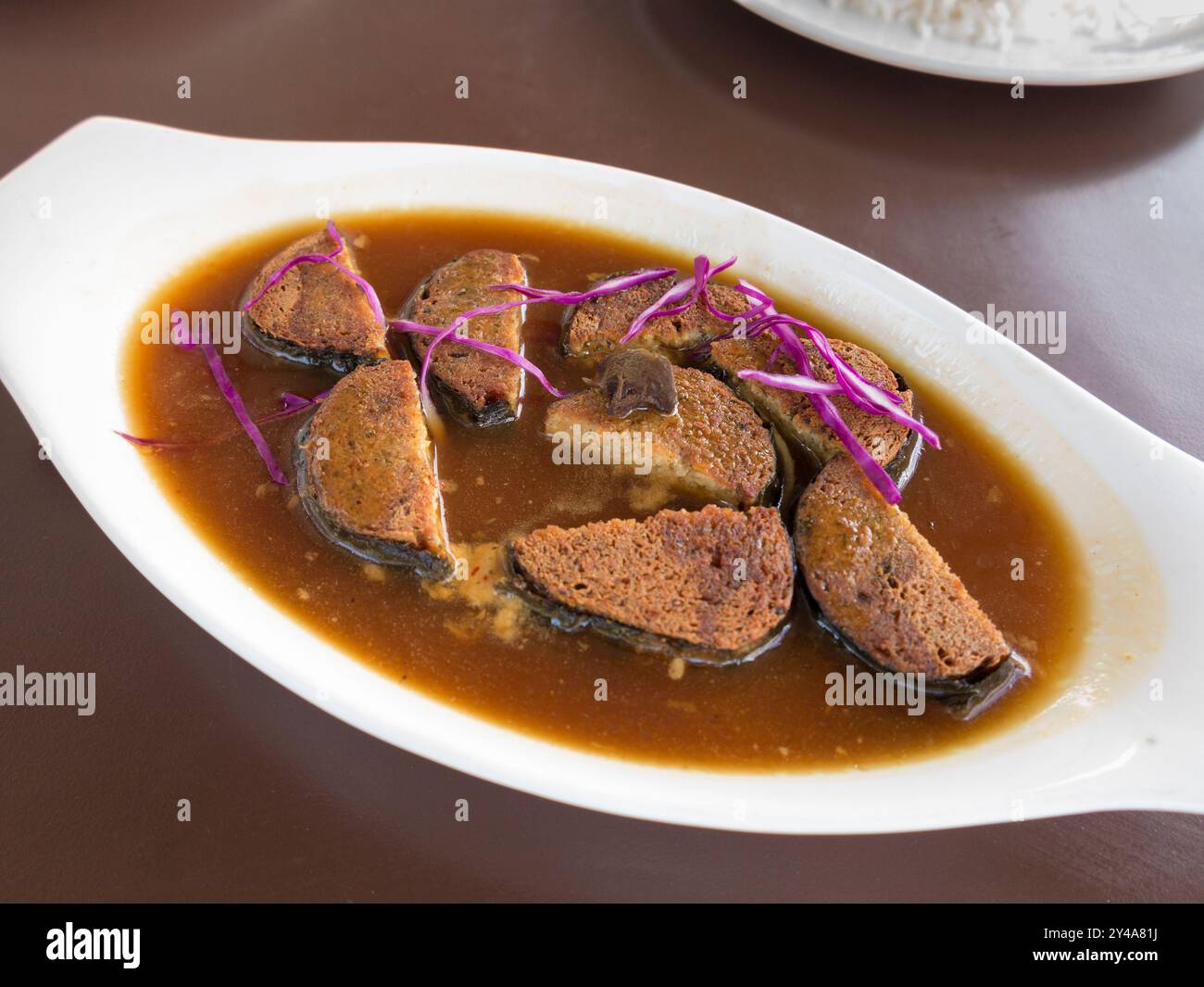 Vegan tofu fish fillets in gravy Stock Photo - Alamy