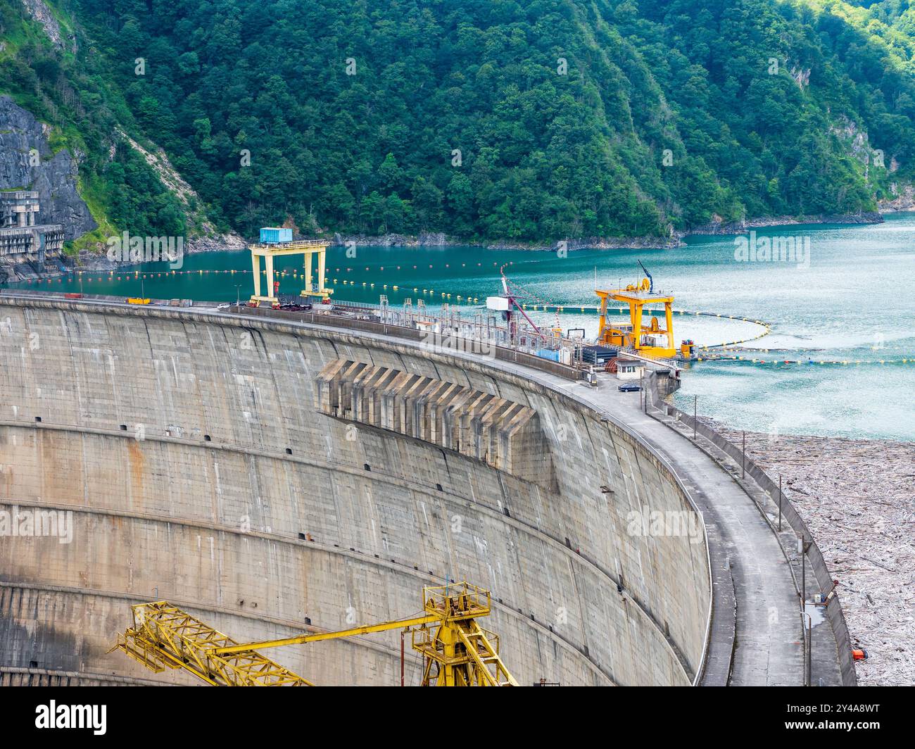 Industrial cranes and equipment on Enguri Hydropower Dam in Georgia ...