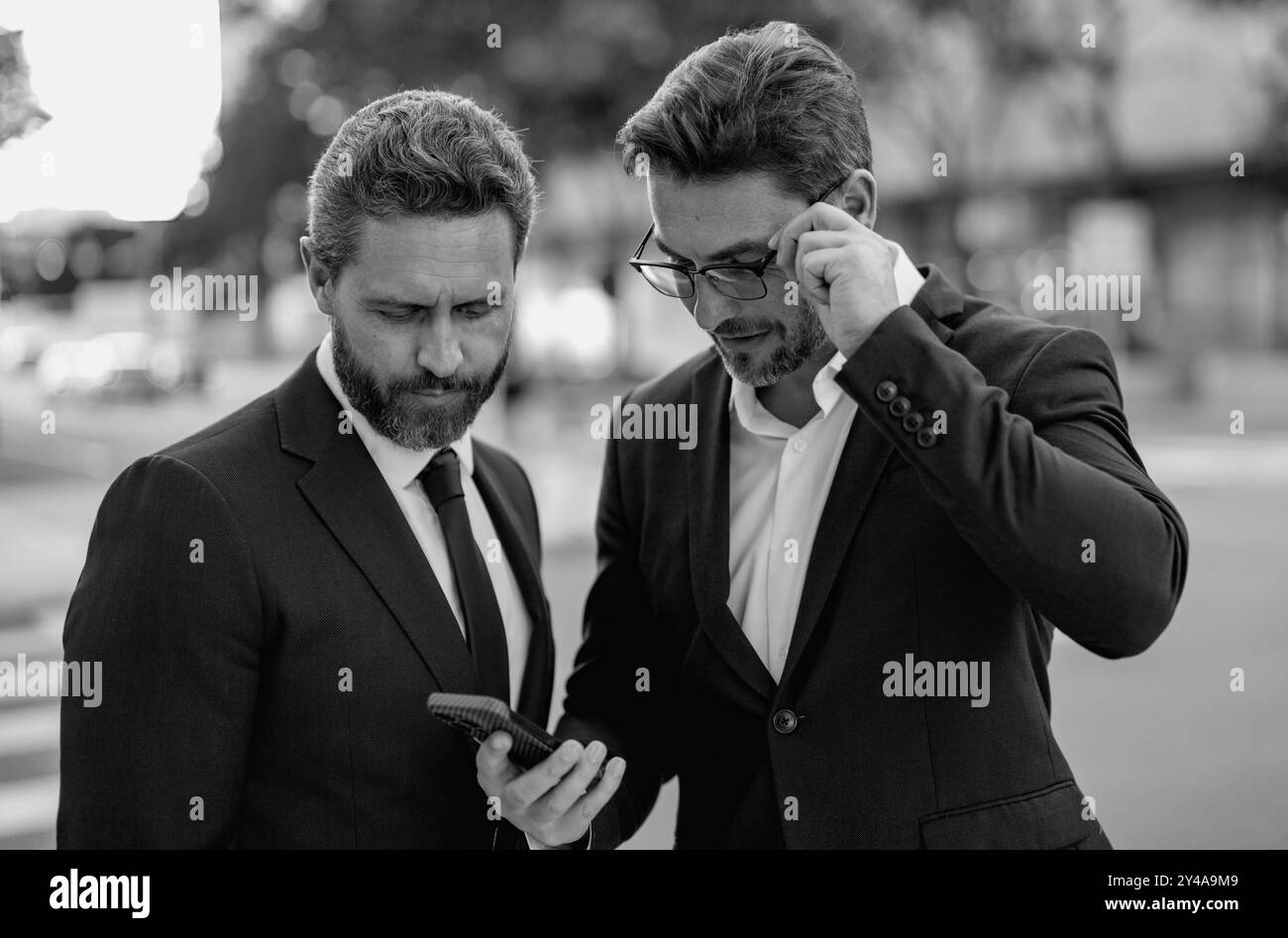 Successful man in suit texting Black and White Stock Photos & Images ...