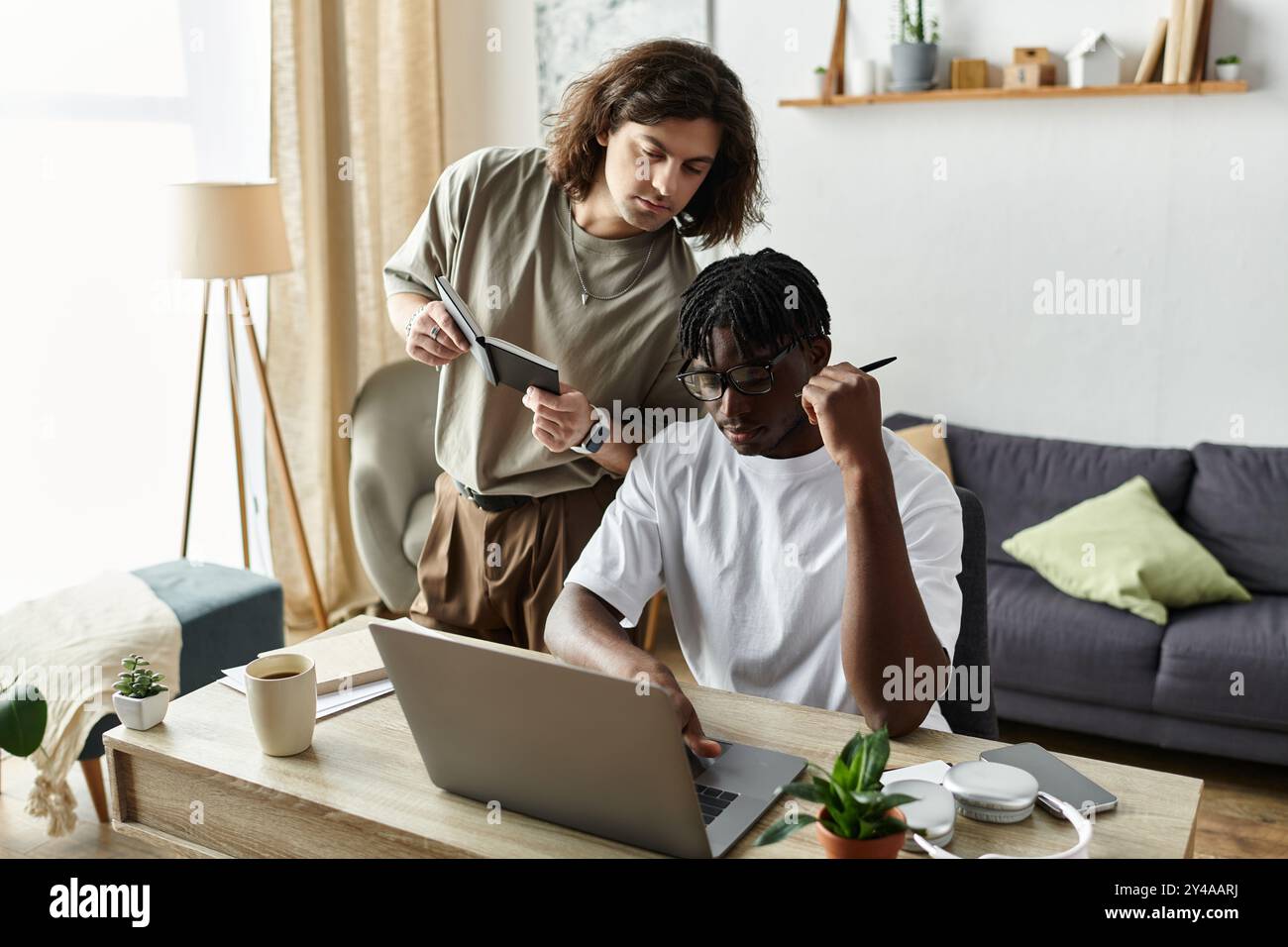 Two partners enjoy each other while studying and collaborating at home ...