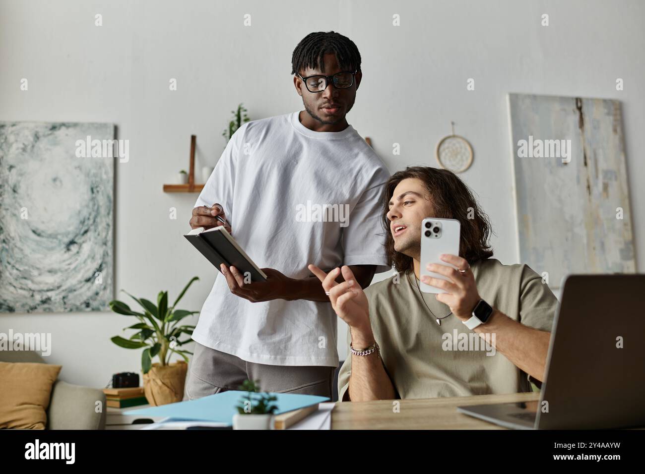 Two partners engage in a warm conversation while working side by side ...