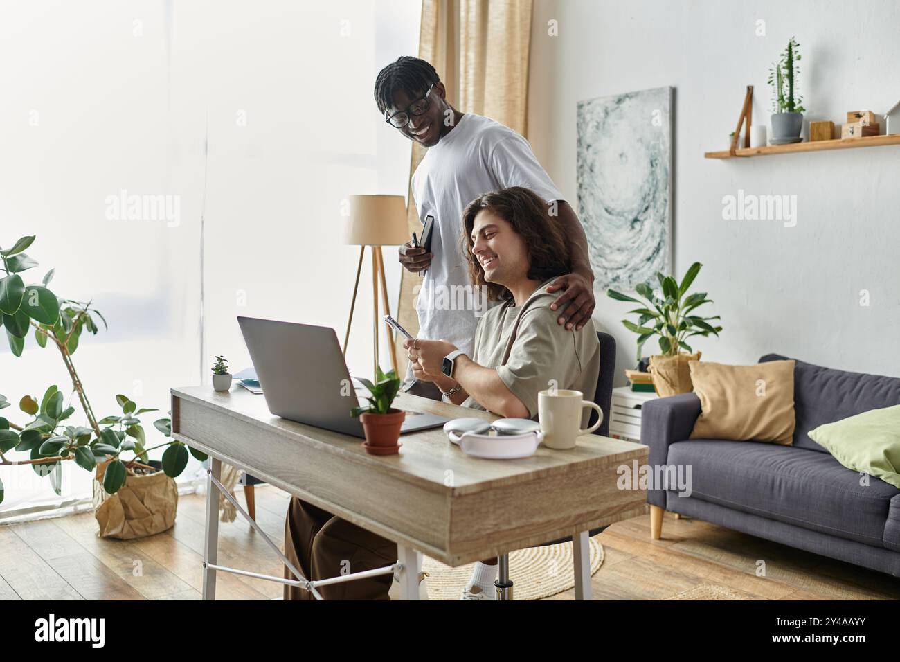 A loving couple shares laughter and warmth while working on their ...