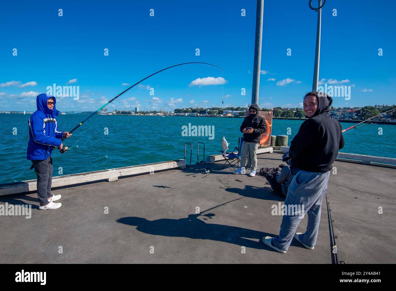 Even on a windy April day, Devonport Wharf fronting onto Auckland ...