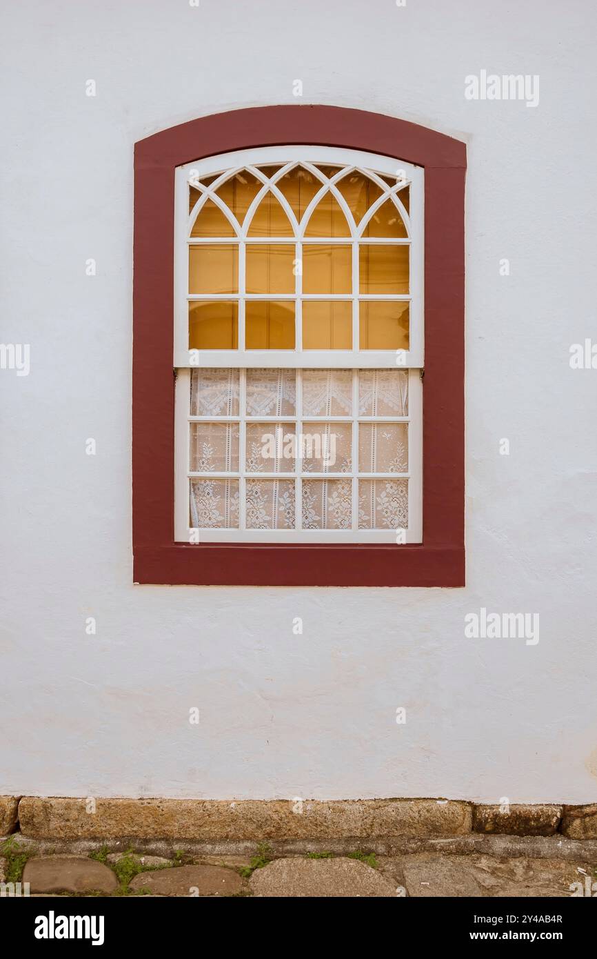Paraty, Brazil. Colorful window with lace curtain of old colonial ...