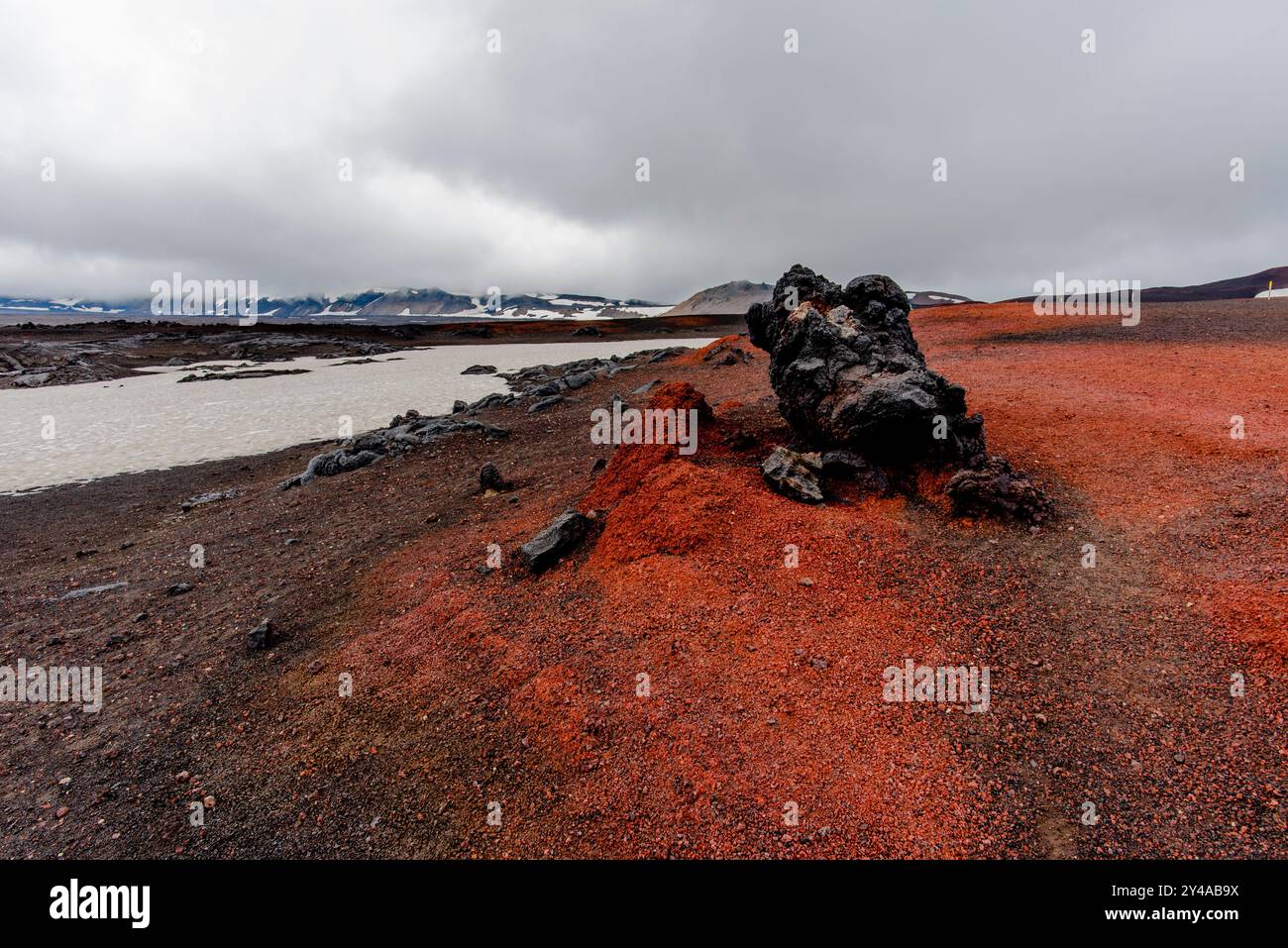 expanses of lava rock with black and deep red colors in the crater of ...