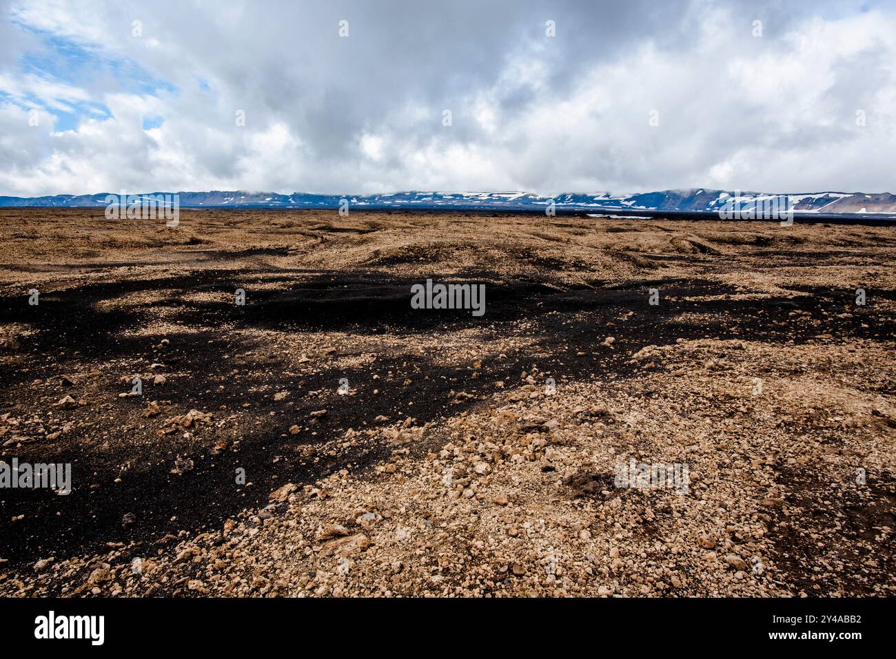 expanses of lava rock with black and deep red colors in the crater of ...