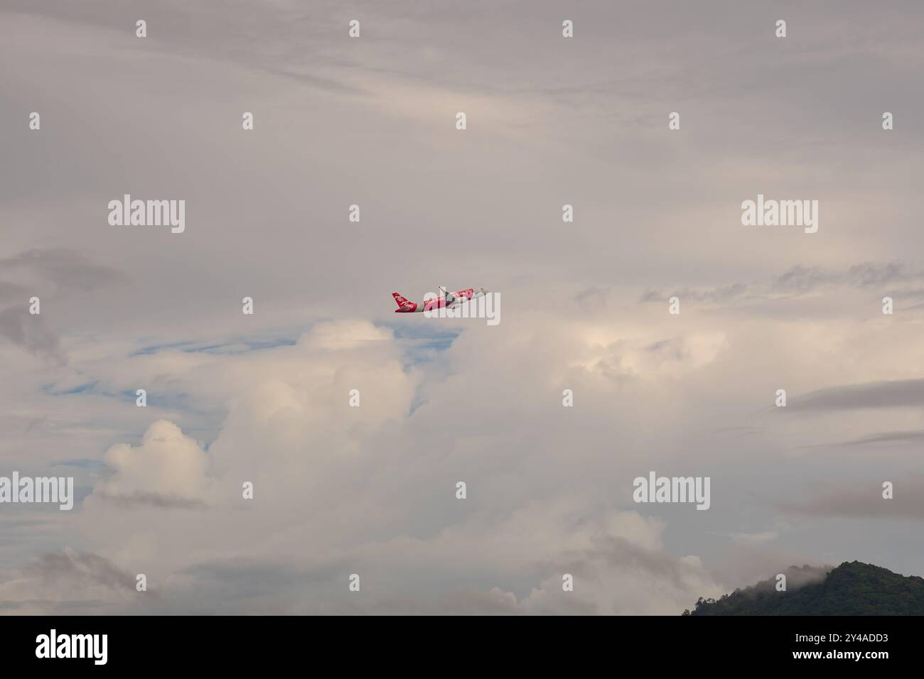 Air Asia Airlines. Boeing 320 flying in the air with blue sky. Travel ...