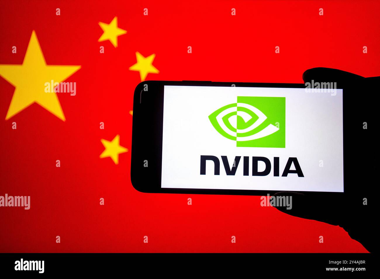 In this photo illustration, a Nvidia logo seen displayed on a ...