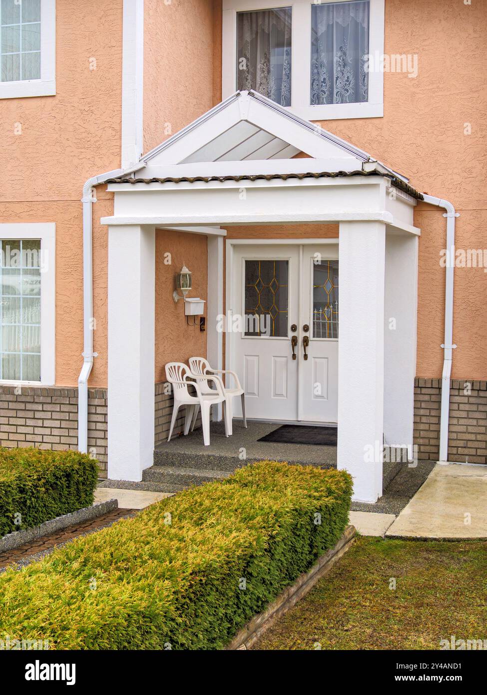 Entrance of residential house under transparent porch Stock Photo - Alamy