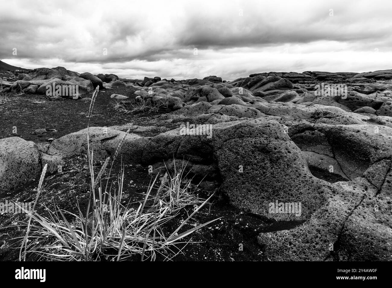 expanses of lava rock with black and deep red colors in the crater of ...