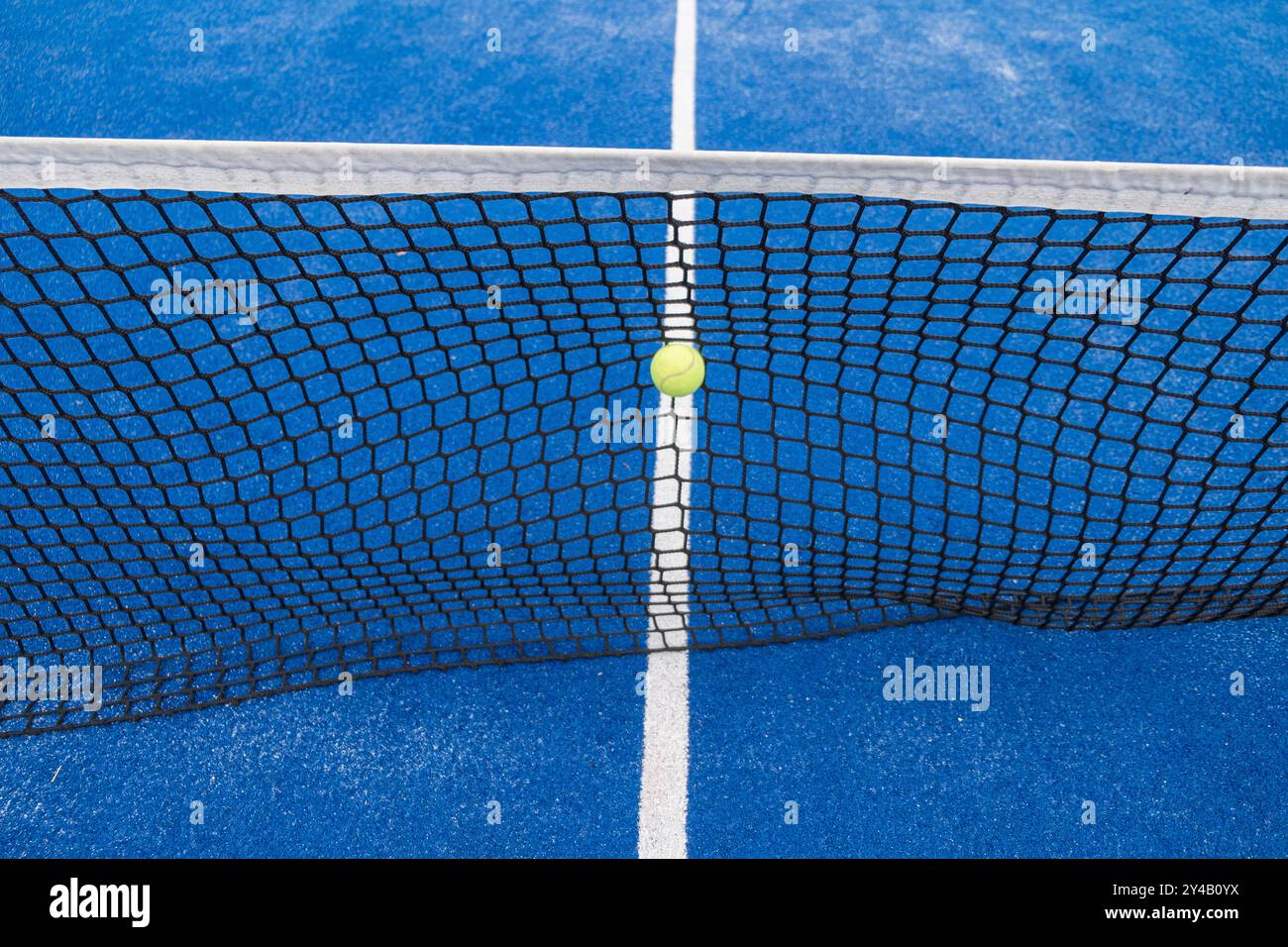 a ball hitting the net of a paddle tennis court Stock Photo - Alamy