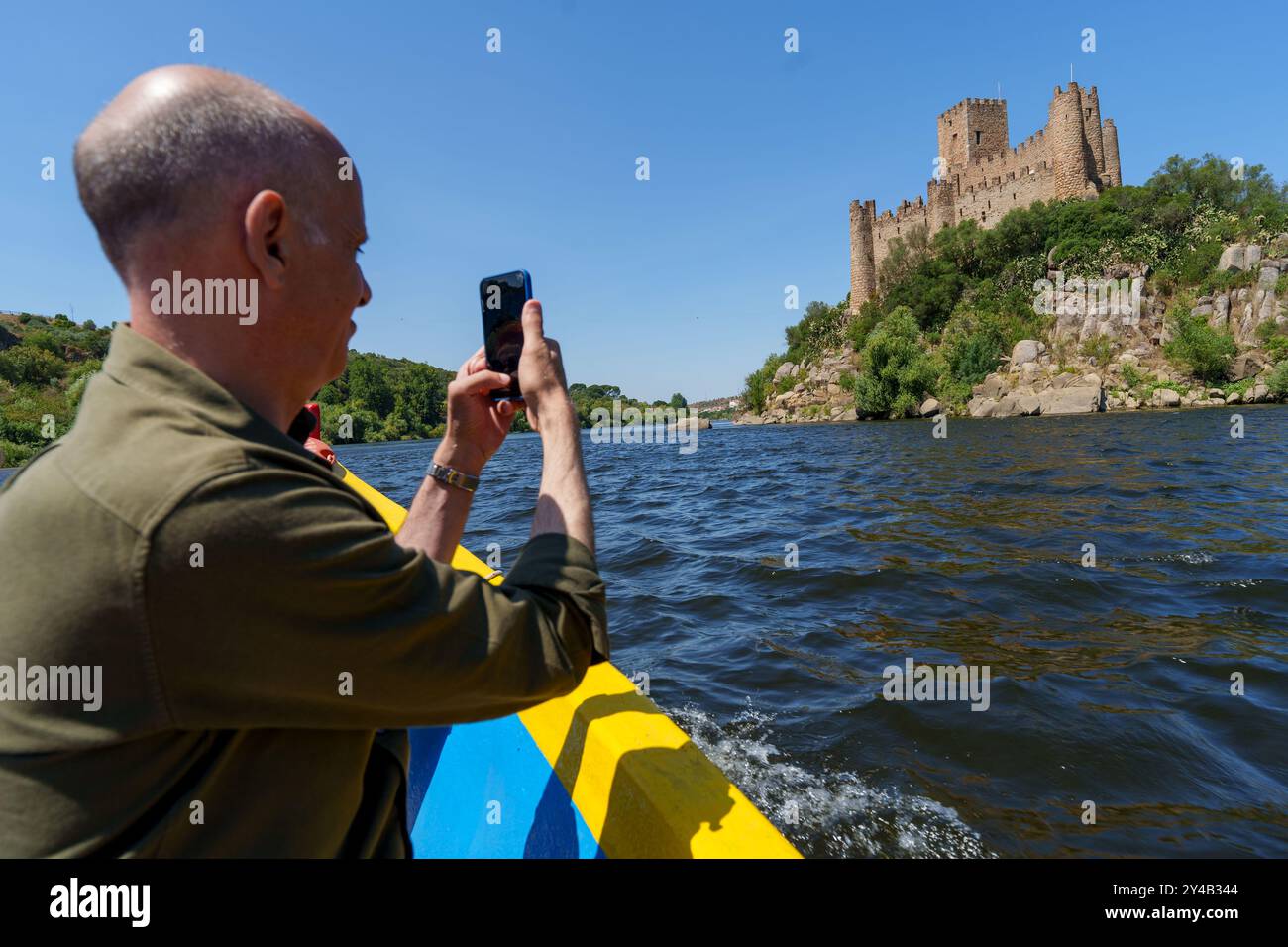 Tourist taking photos of the Castelo de Almourol medieval castle ...