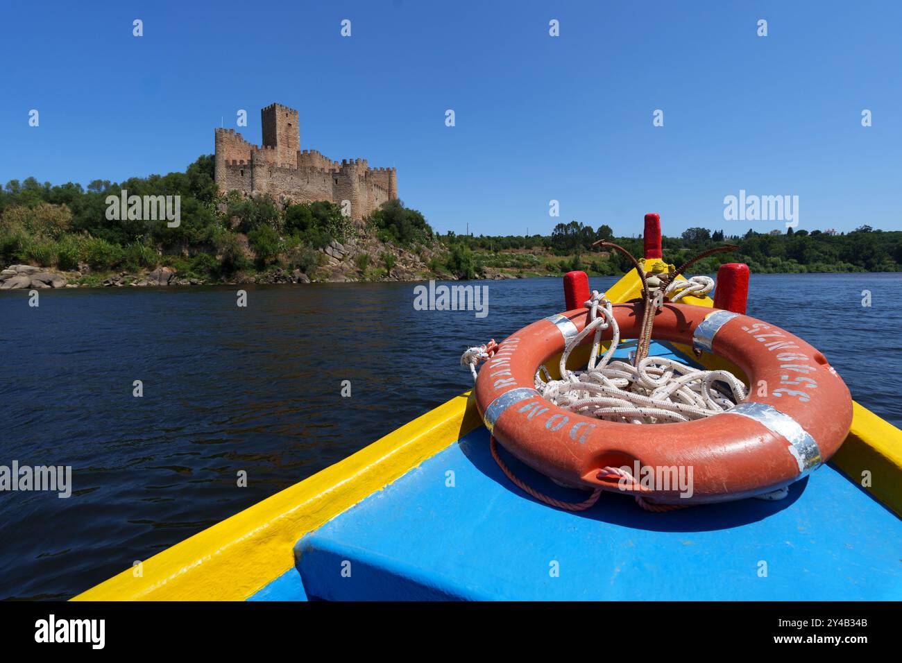 Bow of a tour boat passing by the Castelo de Almourol medieval castle ...
