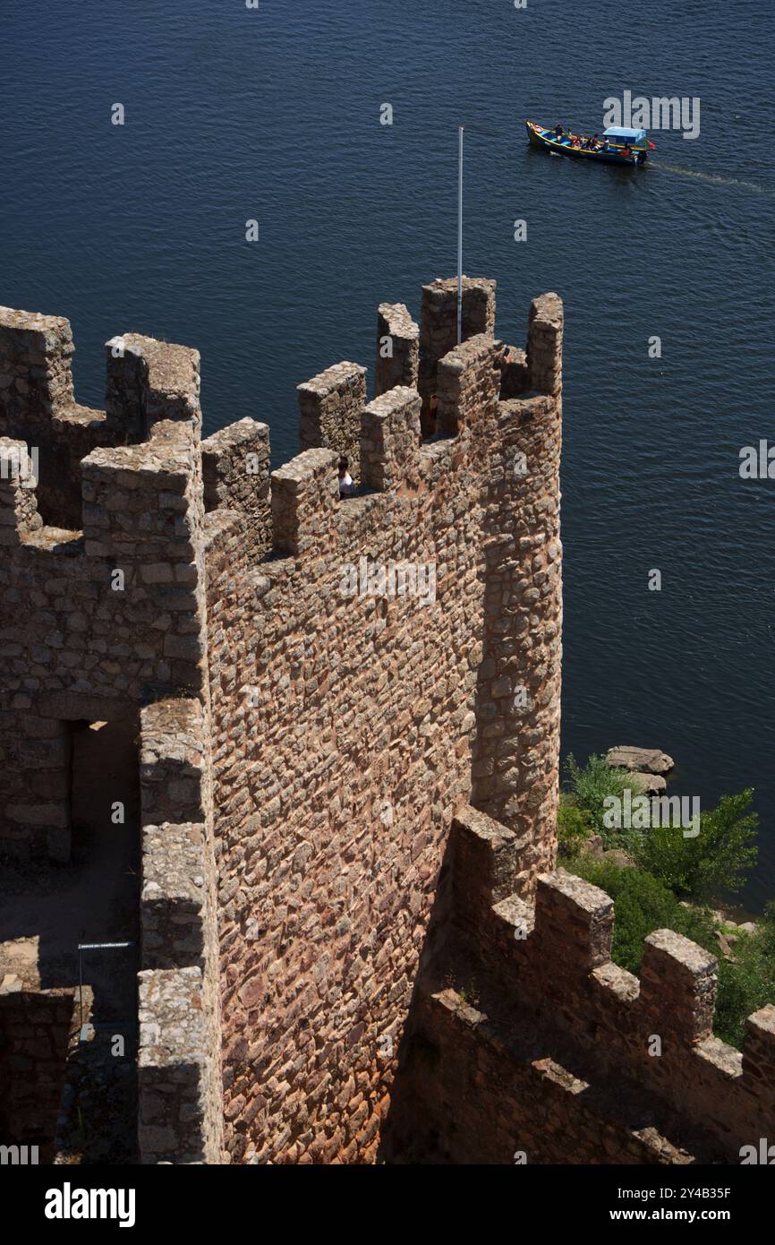 Aerial view of a tour boat passing by the Castelo de Almourol medieval ...