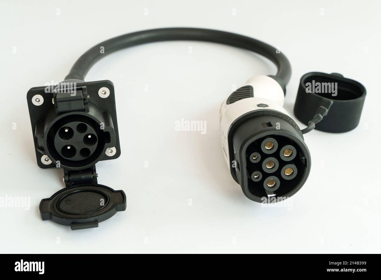 Type 1 to Type 2 EV charging cable adapter cutout isolated on white ...