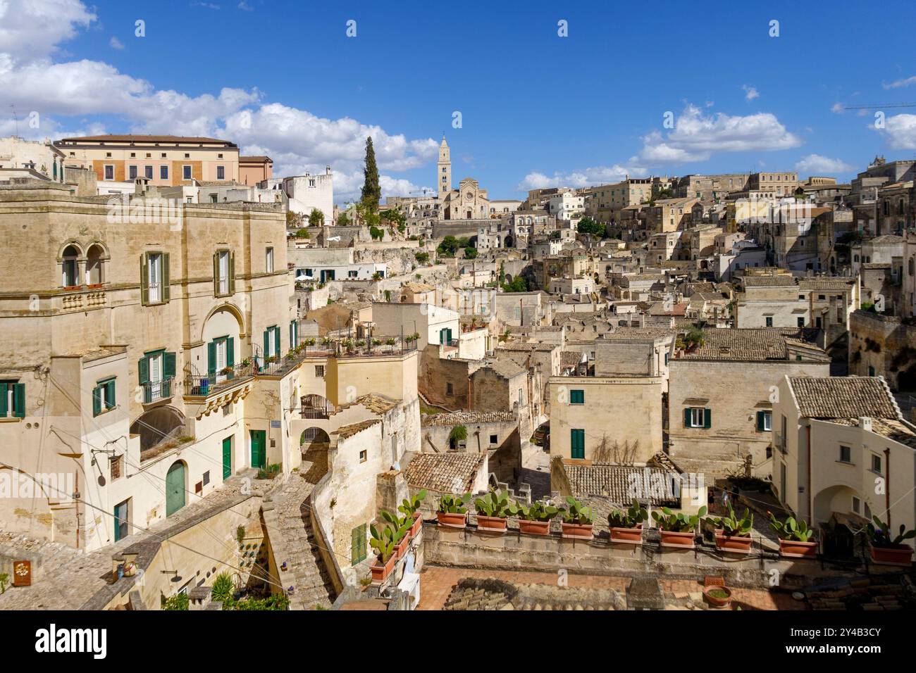 Historic cityscape of Matera with ancient stone buildings and rugged ...