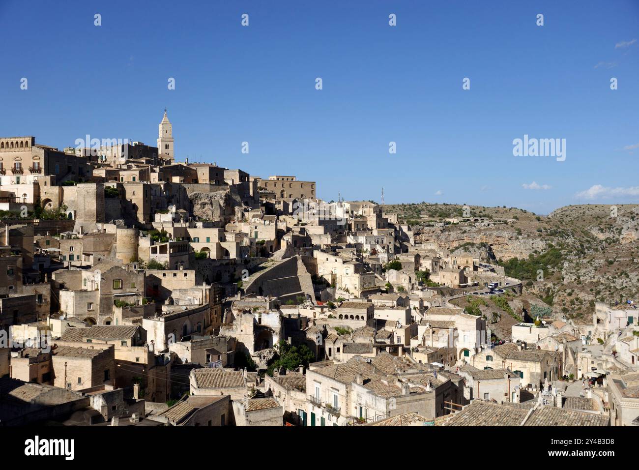 Historic cityscape of Matera with ancient stone buildings and rugged ...