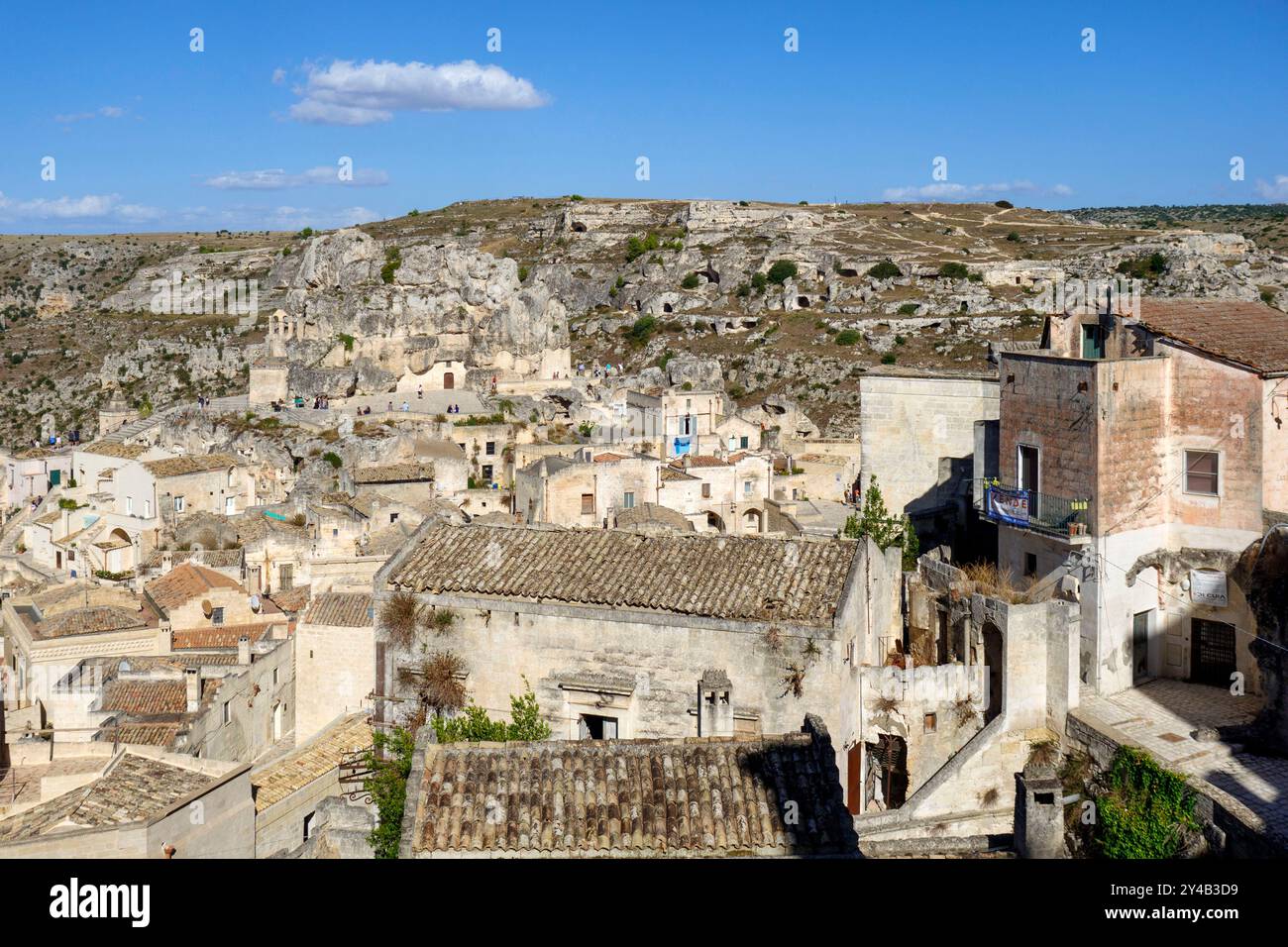 Historic cityscape of Matera with ancient stone buildings and rugged ...