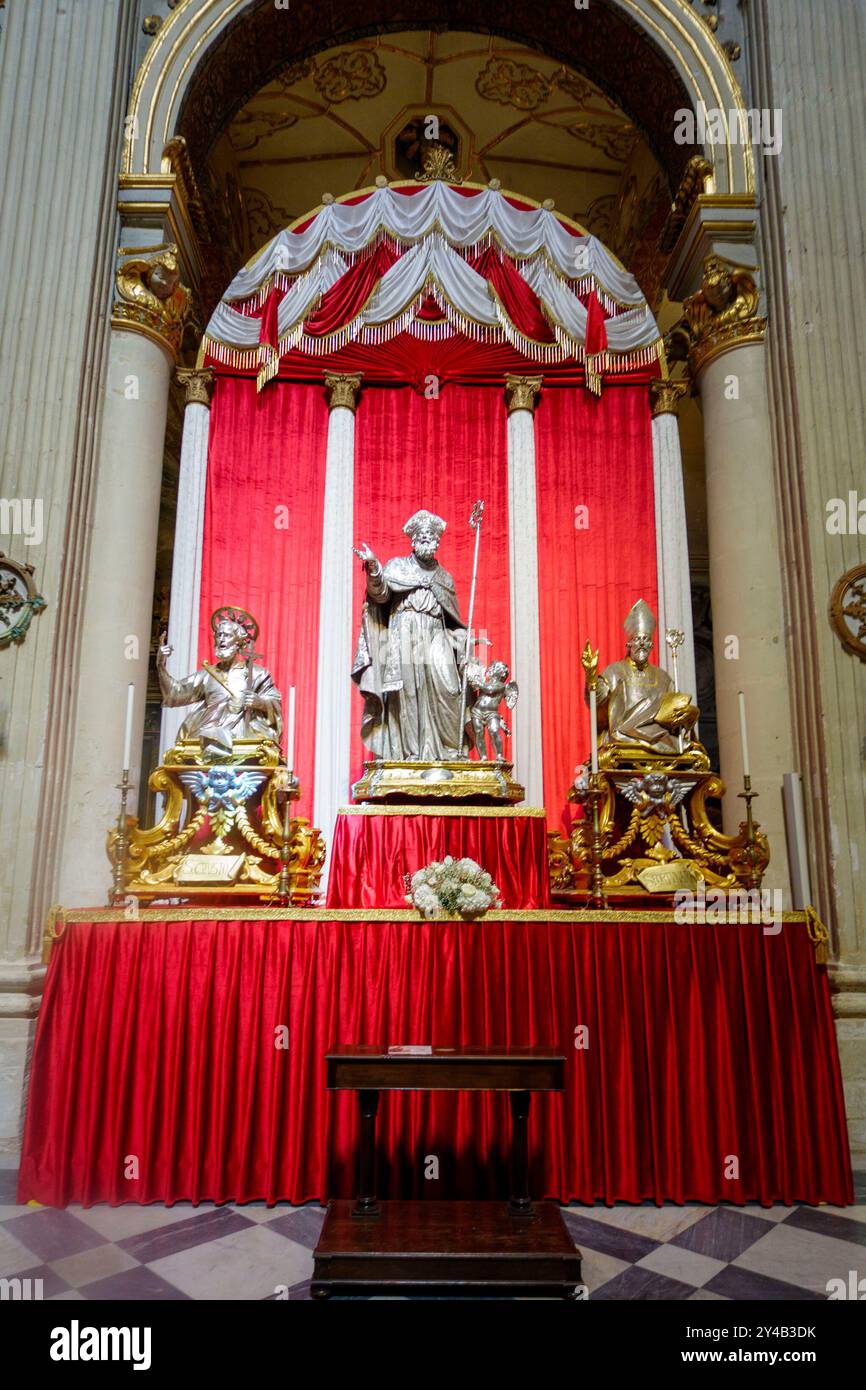 Ornate religious altar with statues of patron saints Oronzo, Giusto ...