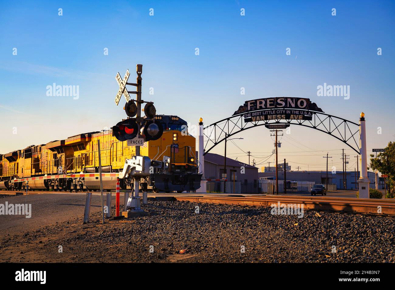 Union Pacific train passing through Fresno, California at sunset Stock ...