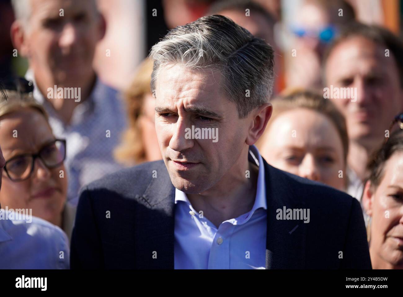 Taoiseach Simon Harris talks to the media outside the Fine Gael tent at ...